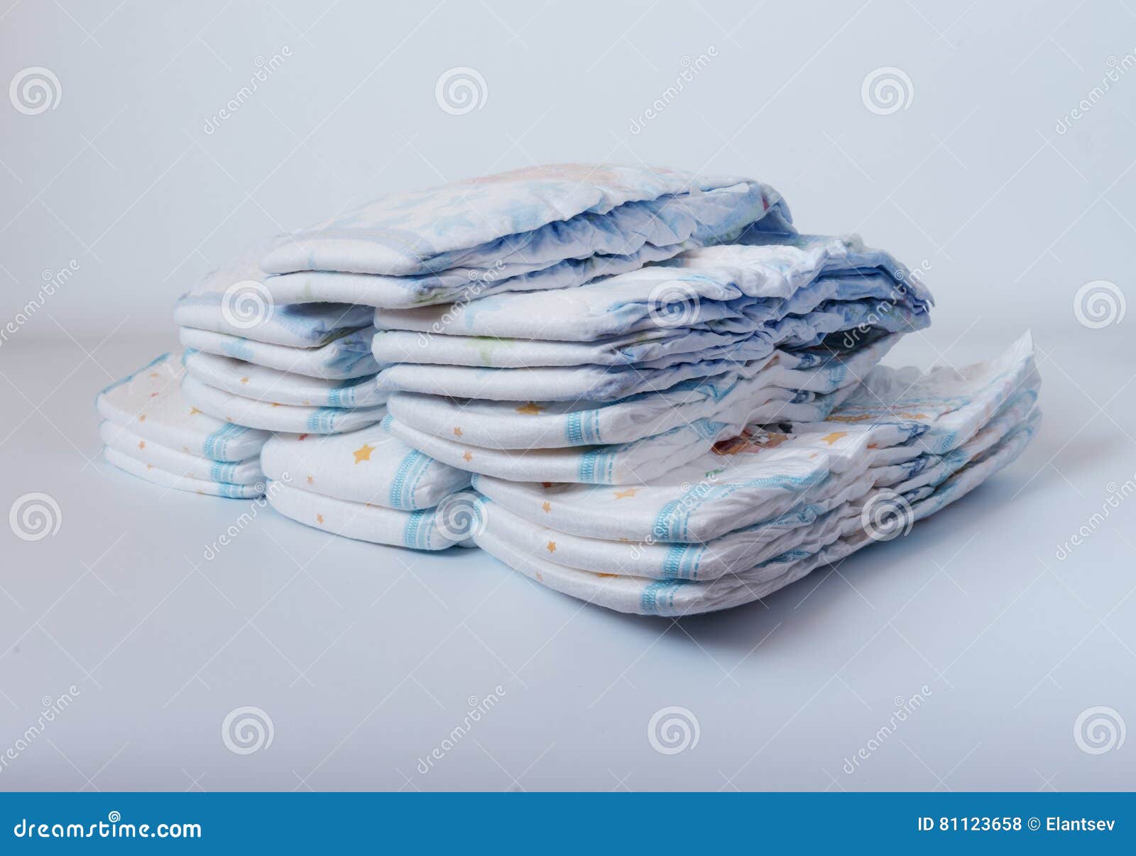 Stacks of Diapers Stacked in Staggered Rows on a White Background Stock ...