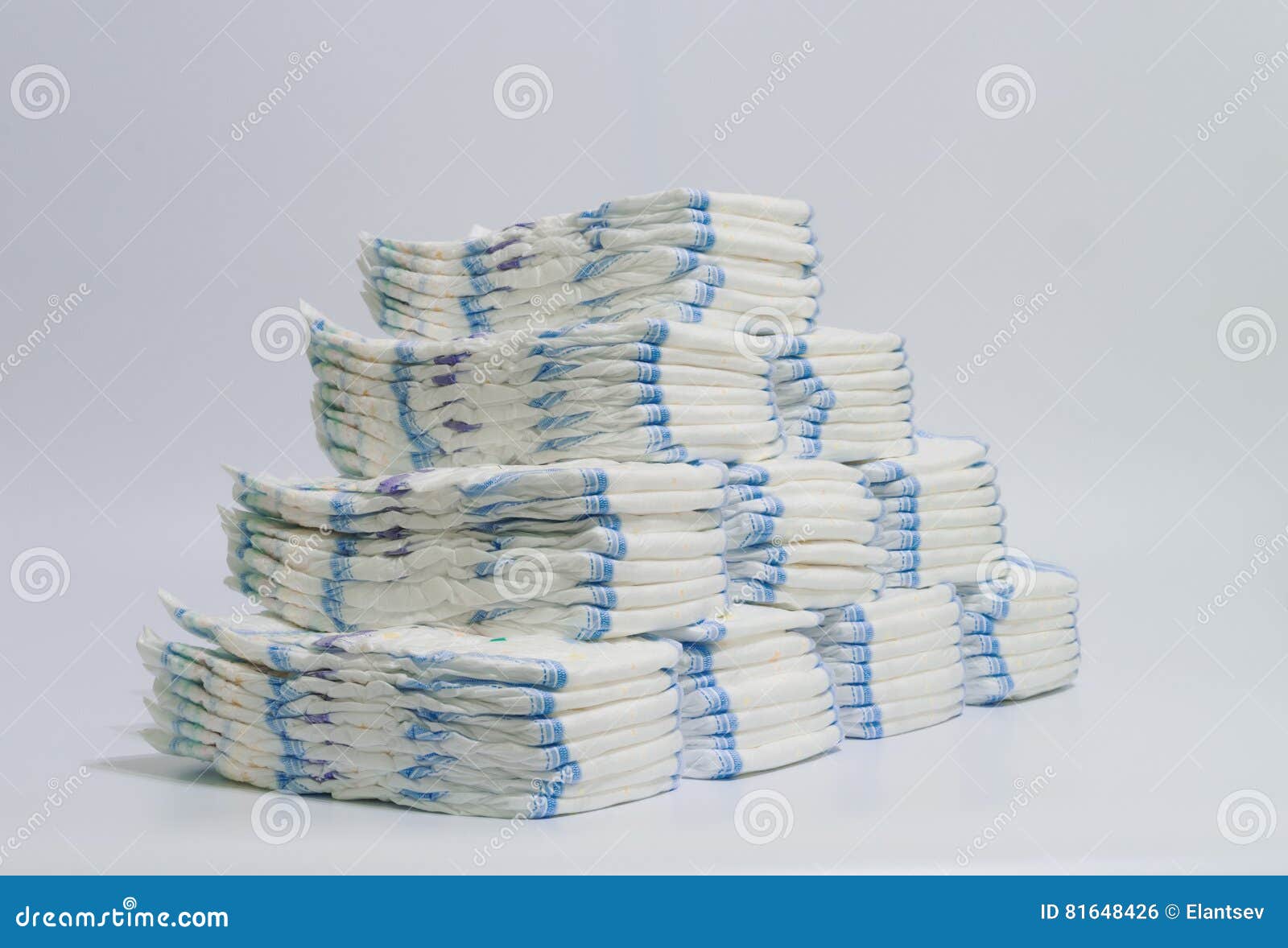Stacks of Diapers Stacked in Staggered Rows on a White Background Stock ...