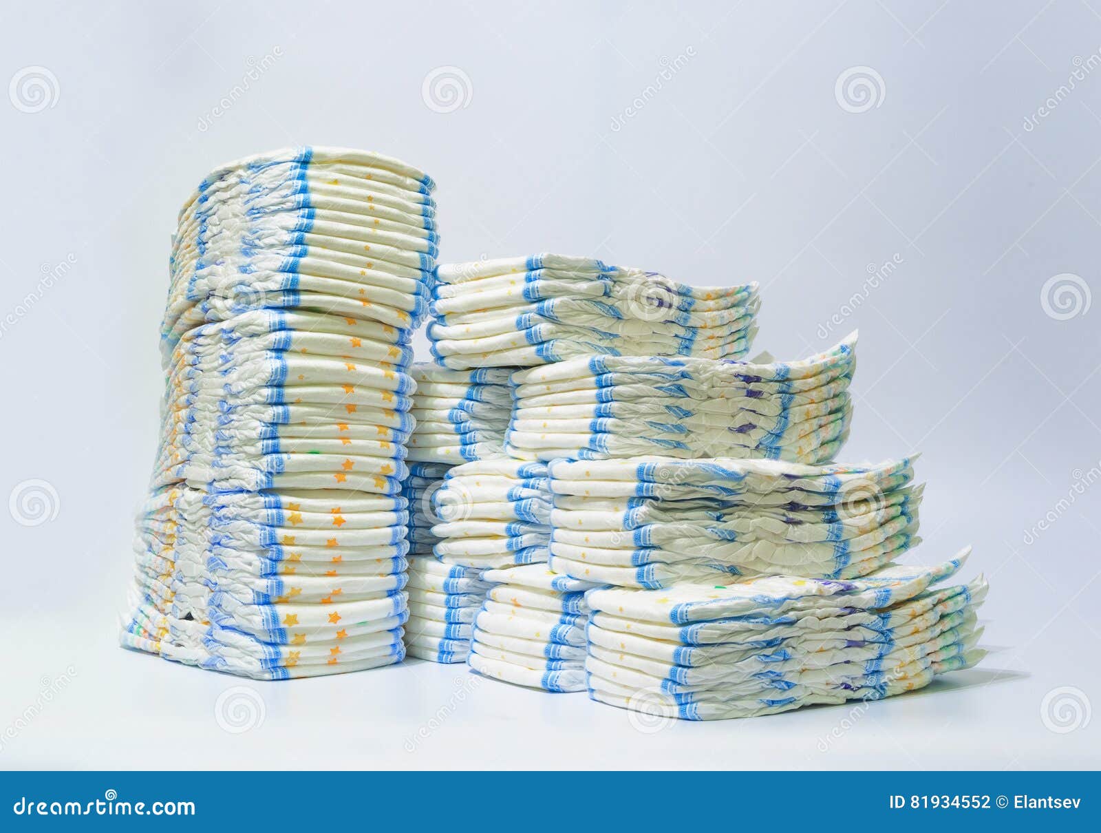 Stacks Of Diapers Stacked In Staggered Rows On A White Background ...