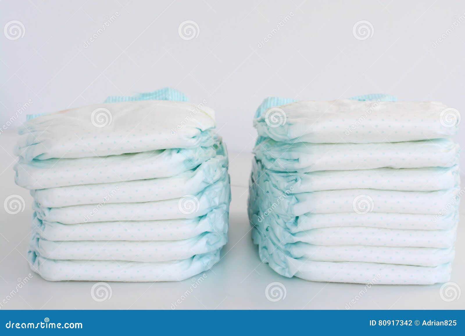 Stacks Of Diapers Stacked In Staggered Rows On A White Background ...