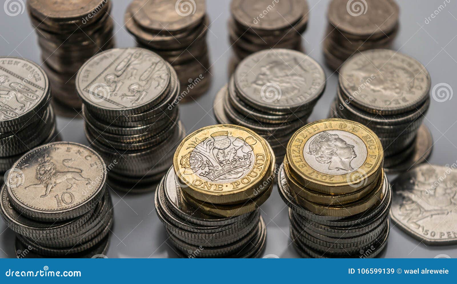 Stacks of Different British Coins on a White Background. Editorial ...