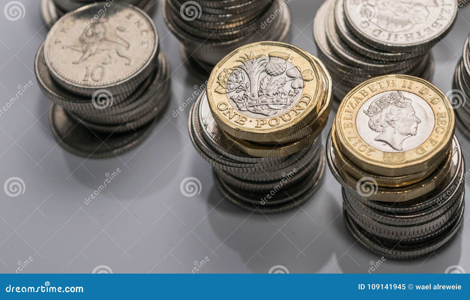 Stacks of Different British Coins on a White Background. Editorial ...