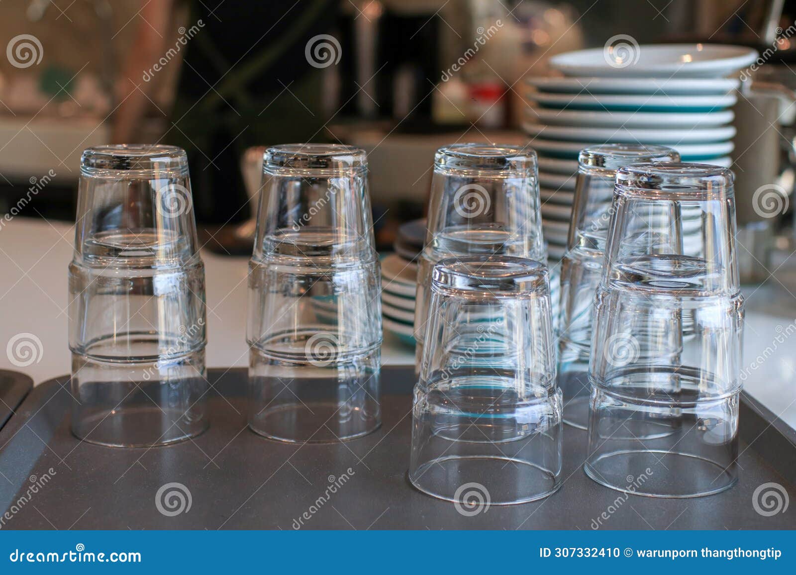 Stacks of Empty Glasses on Bar Counter in Cafe. Piles of Upside Down ...