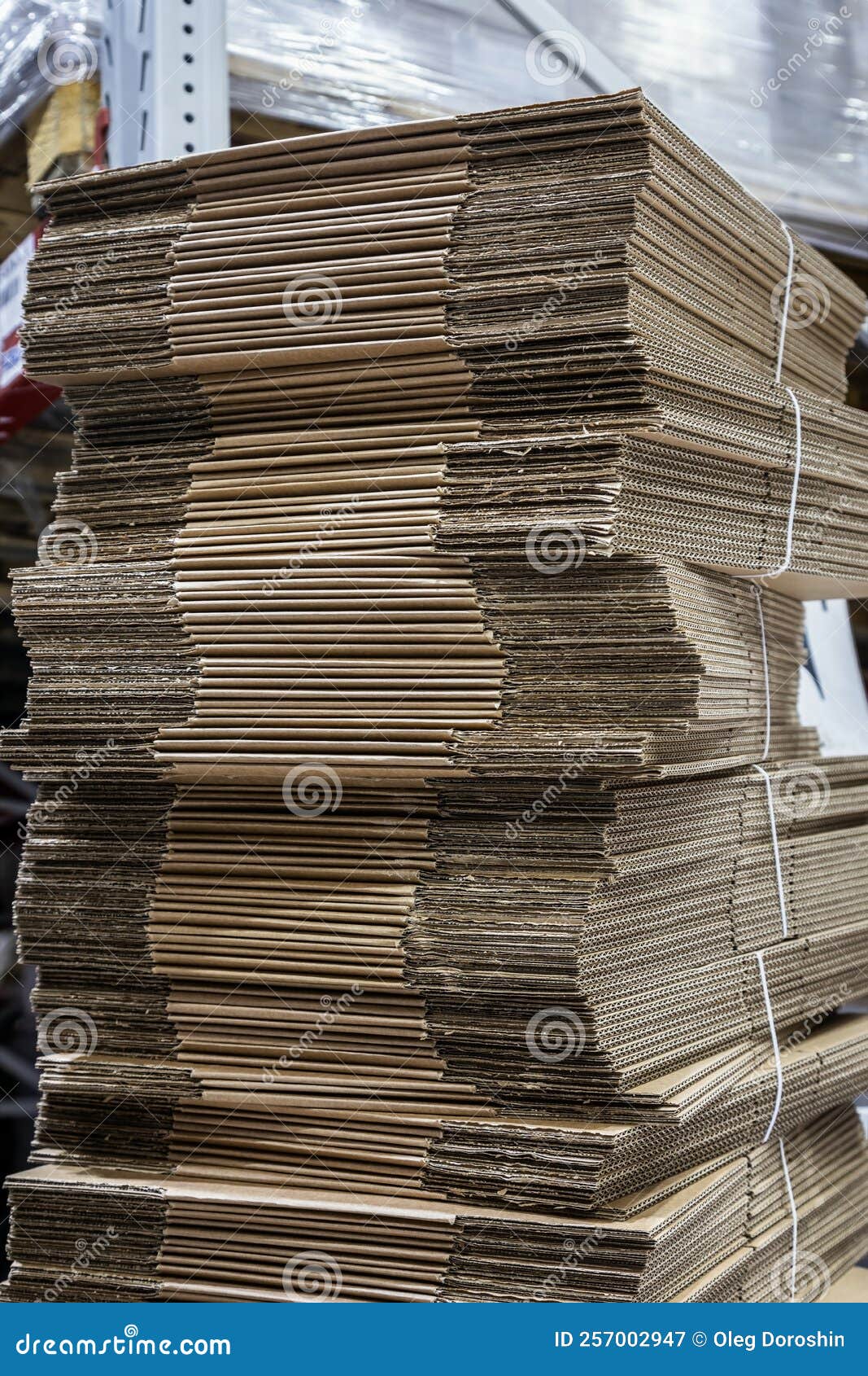Folded Cardboard Boxes In The Warehouse. Stack Of Flat Industrial ...