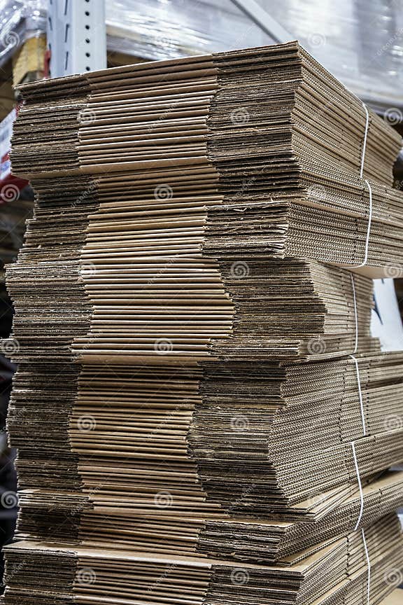 Stacks of Folded Cardboard Boxes in a Warehouse or in a Store Stock ...