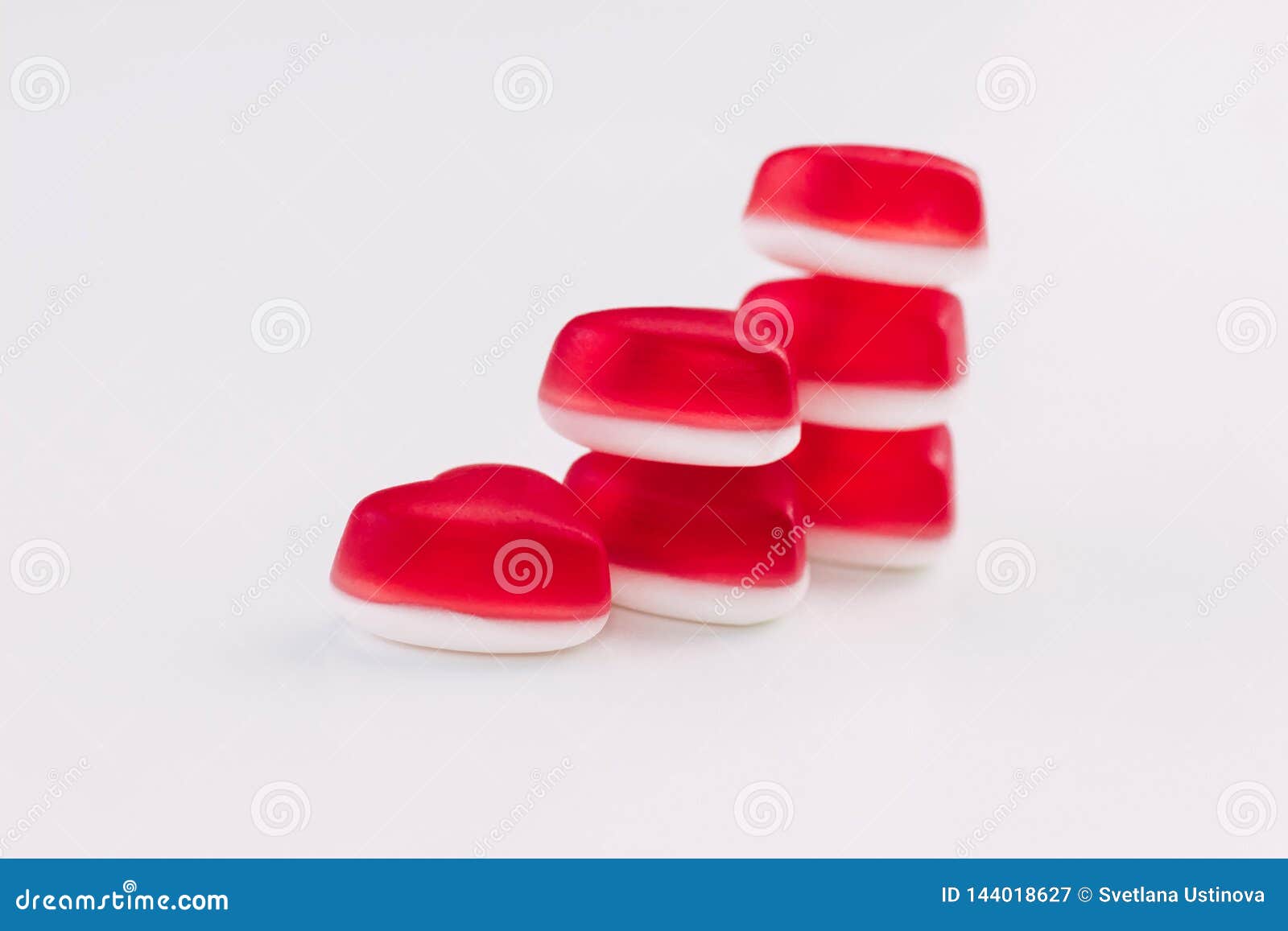 Stacks of Heart Shaped Red Jelly Sweets on White Background. Copy Space ...