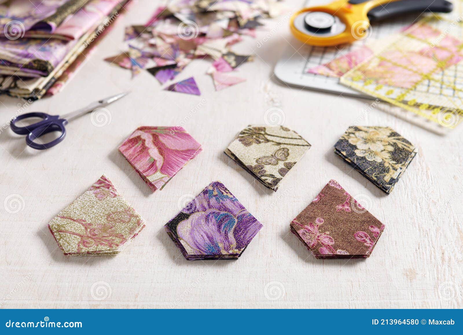 Stacks Of Multi-colored Pentagonal Pieces Of Fabric, Scissors, Ruler ...