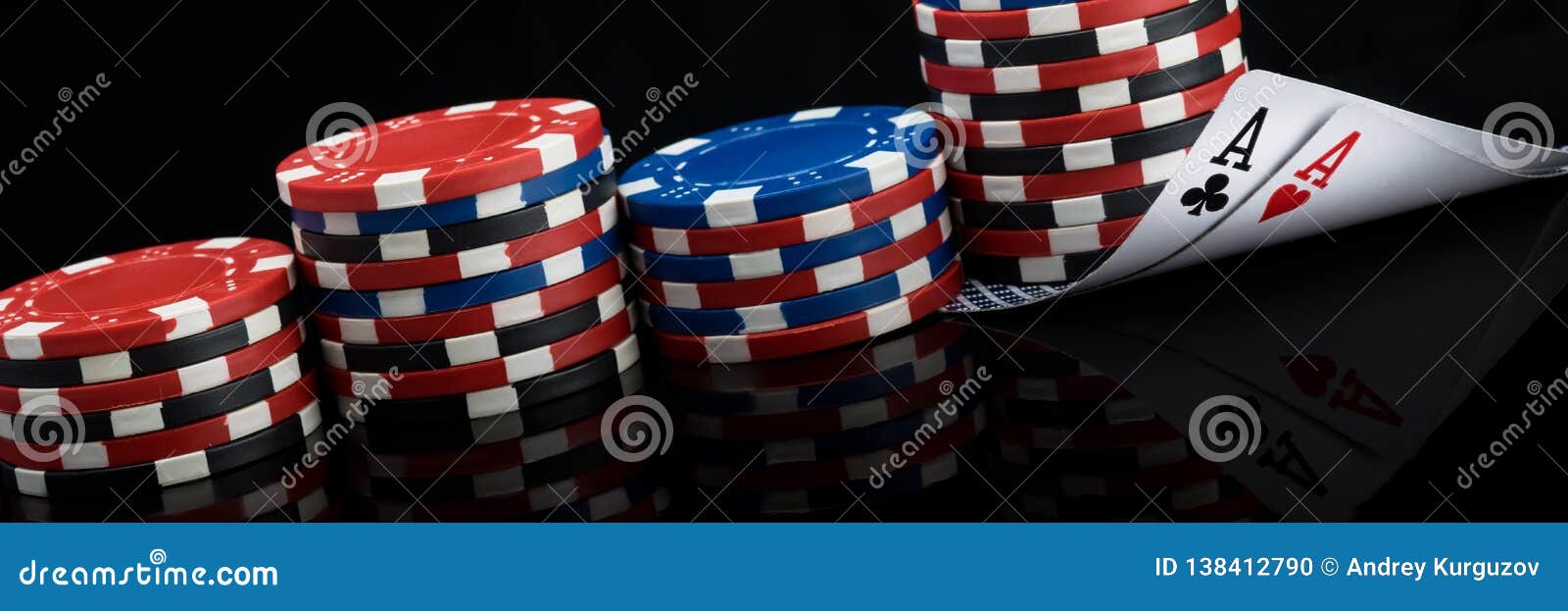 Stacks of Multi-colored Poker Chips and Two Playing Cards on a Black ...