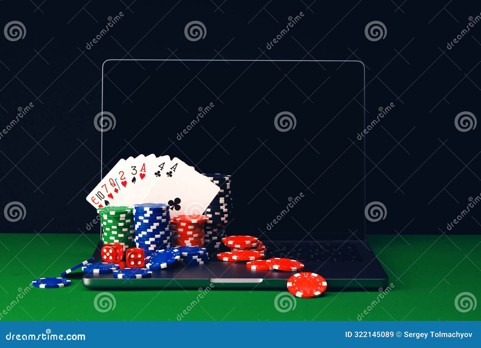 Stacks of Poker Chips and Playing Cards on a Laptop Computer. Stock ...