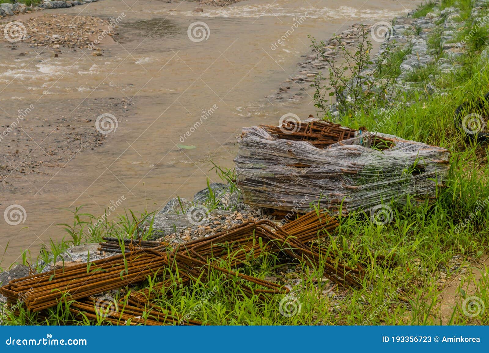 Stacks of Rebar Laying on Shore of River Stock Image - Image of ...