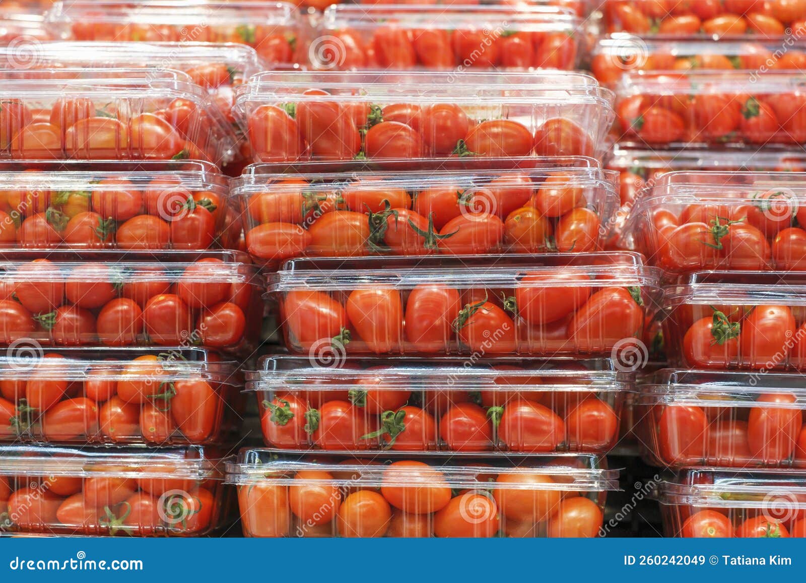 Stacks of Red Cherry Tomatoes in Plastic Containers Close-up in a ...