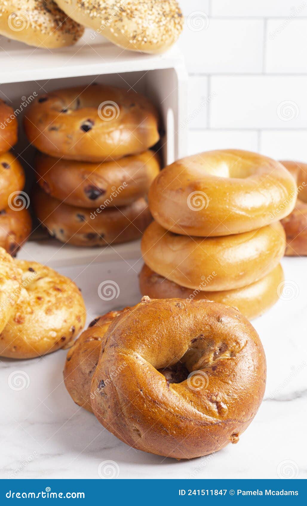 Stacks of Various Flavors of Bagels on a Counter Stock Image - Image of ...