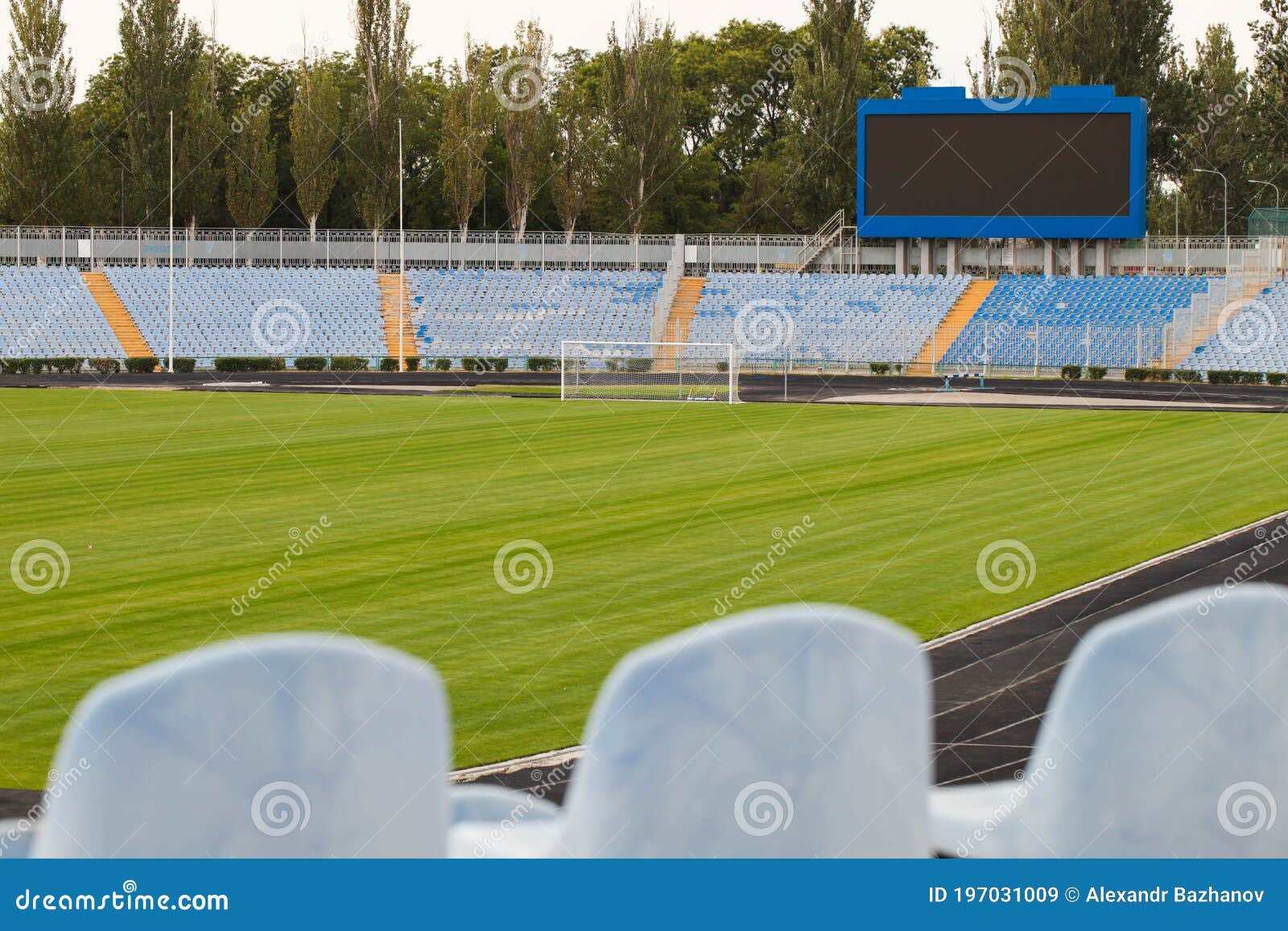 Stadium with a Football Field Stock Image - Image of field, bench ...