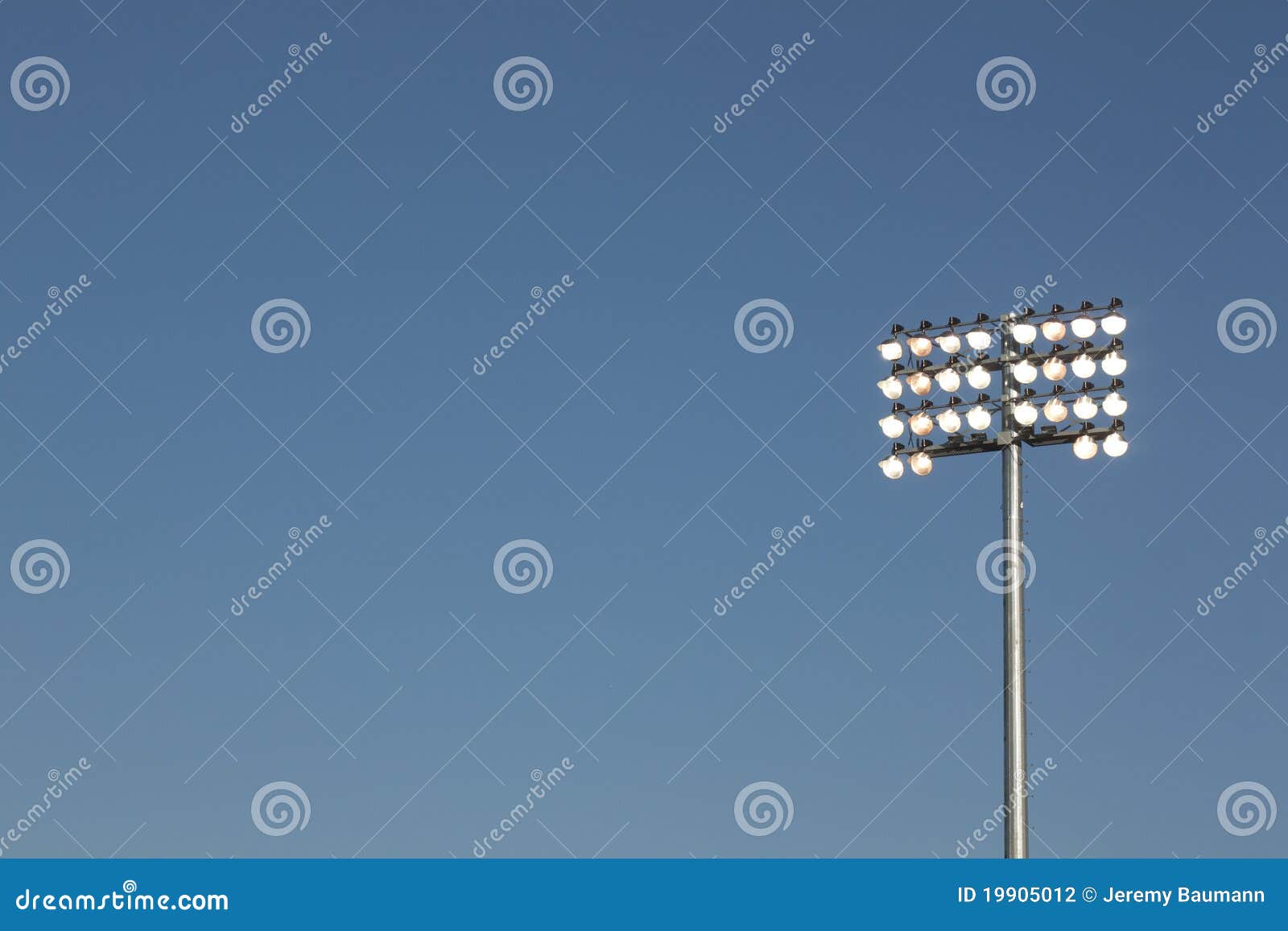 Stadium Lights on a Blue Sky Background Stock Photo - Image of field ...