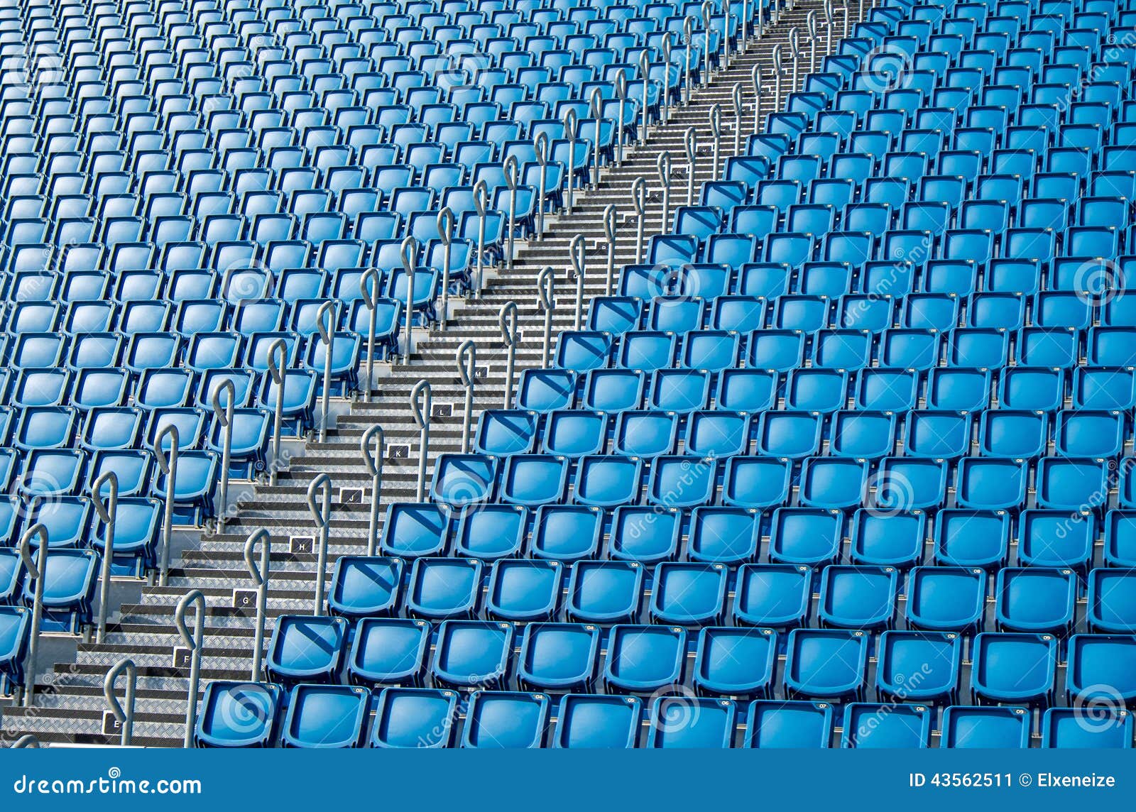 Stadium seats and stairs stock image. Image of chair - 43562511