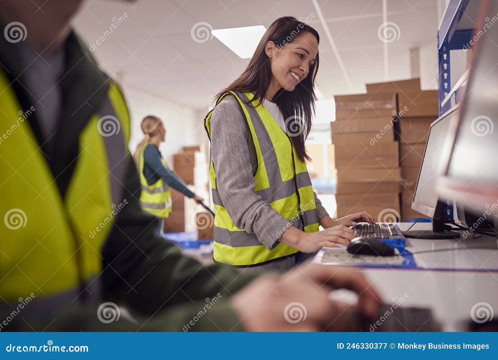 Staff in Busy Modern Warehouse Working on Computer Terminals Stock ... Staff in Busy Modern Warehouse Working on Computer Terminals Stock ...