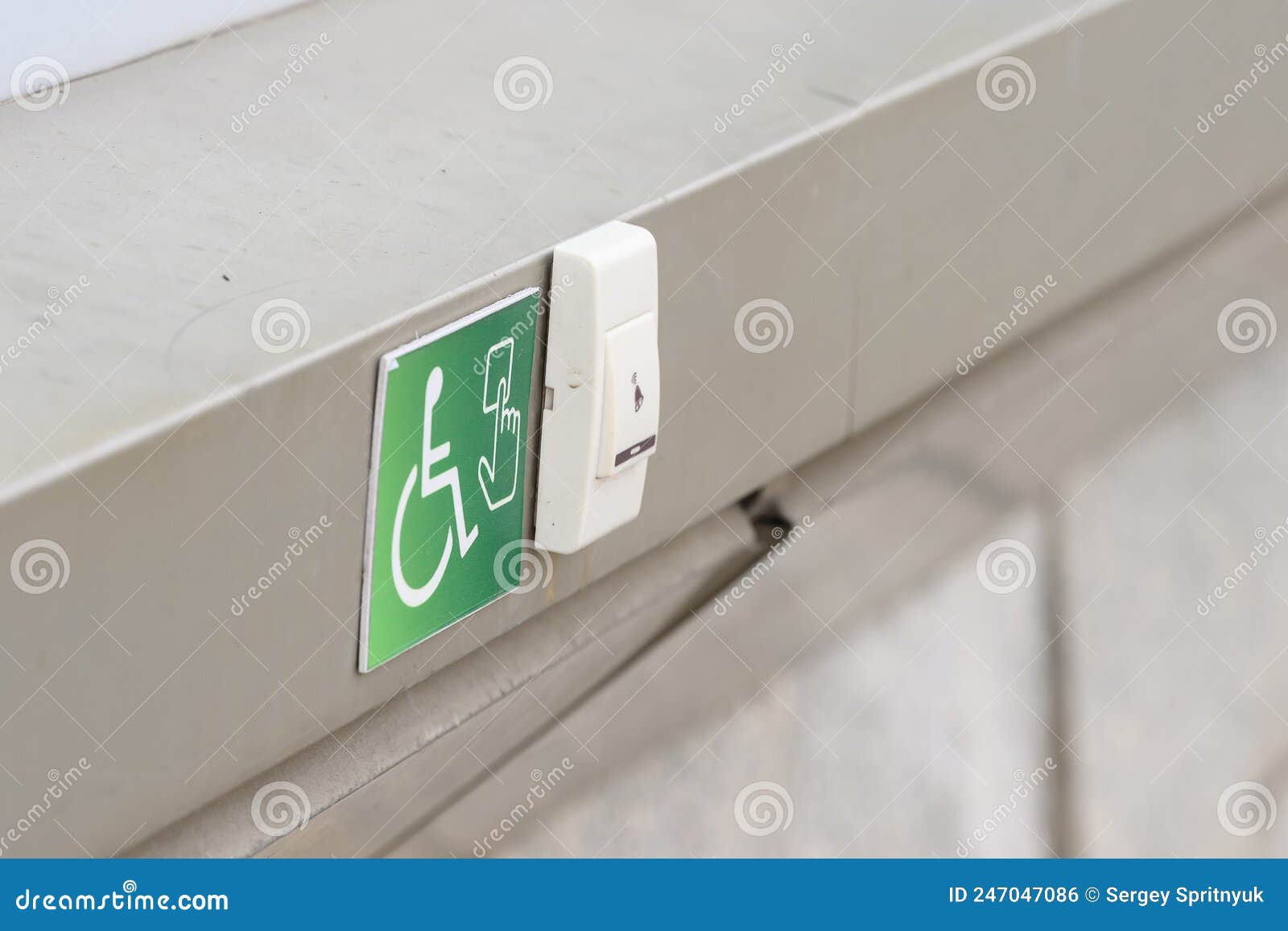 A Staff Call Button for People with Reduced Mobility on a Green Sign ...