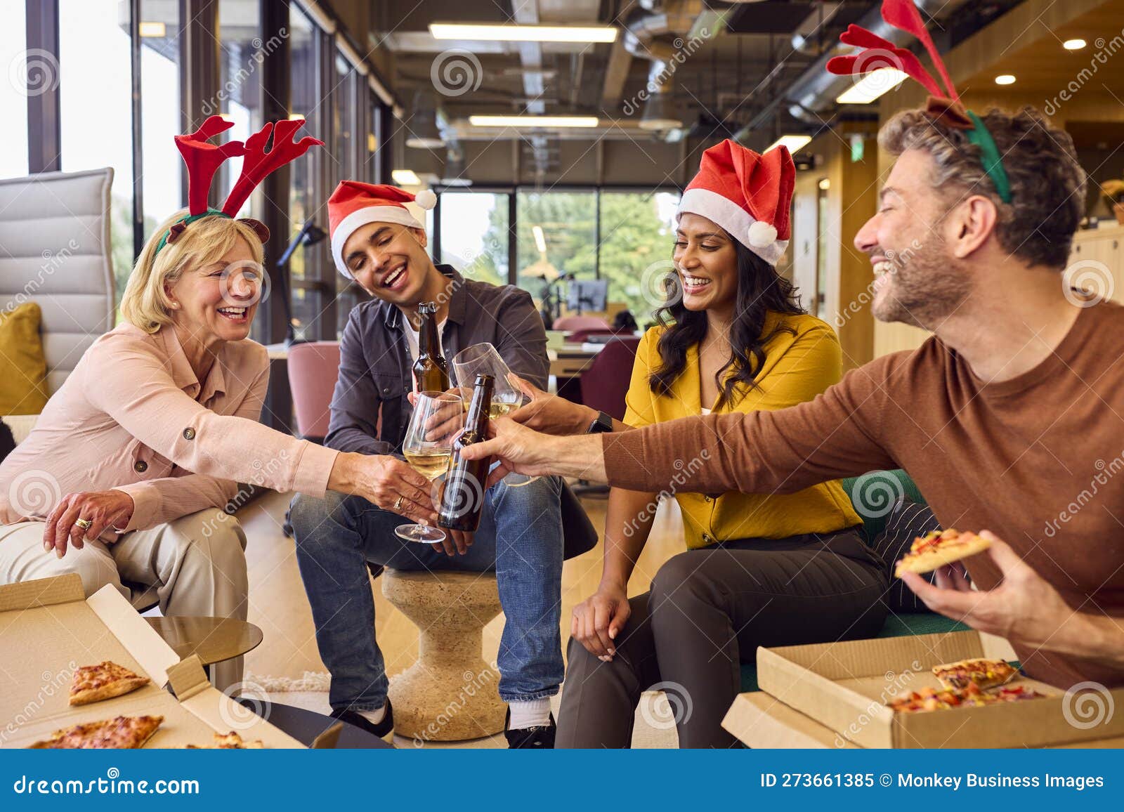 Staff Celebrating at Christmas Party with Meal and Drinks in Office ...