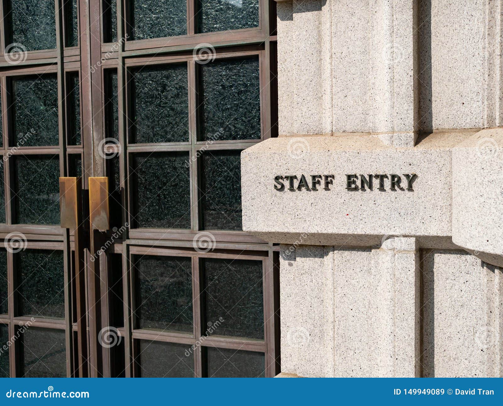 Staff Entry Sign Outside of Office Building Next To Double Doors Stock ...