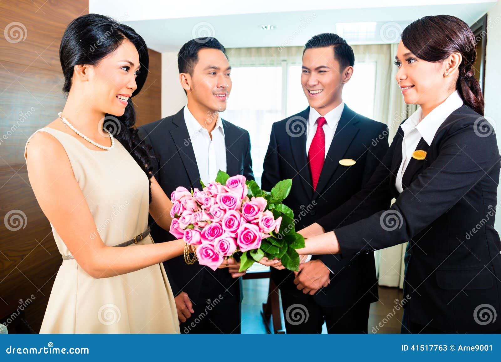 Staff Greeting Guests in Asian Hotel Stock Image - Image of bouquet ...