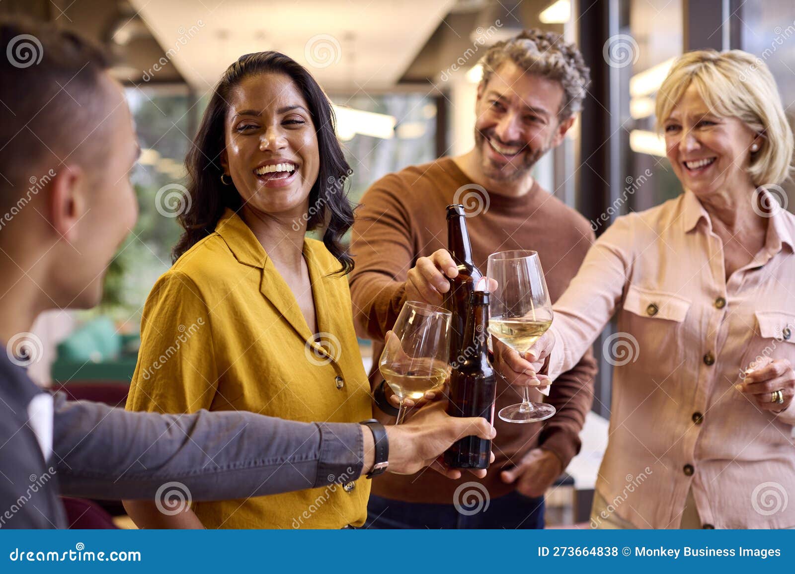 Staff at Informal Team Meeting in Office Celebrating with Drinks Stock ...