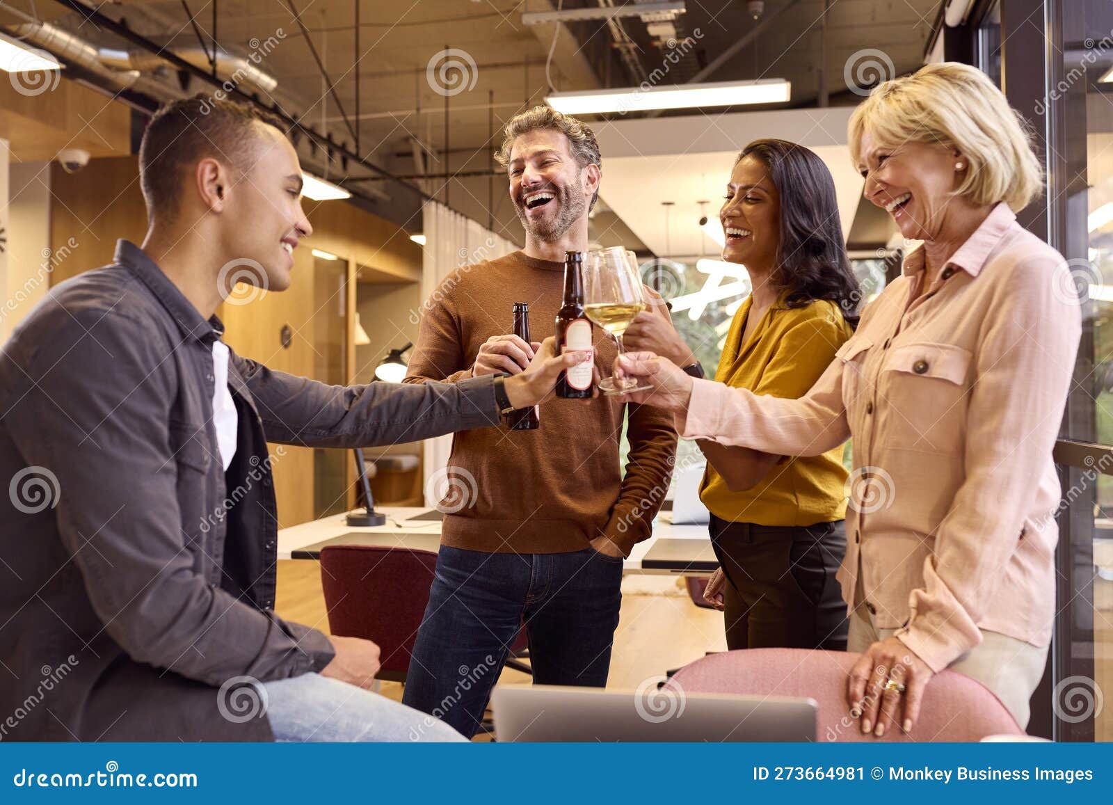 Staff at Informal Team Meeting in Office Celebrating with Drinks Stock ...