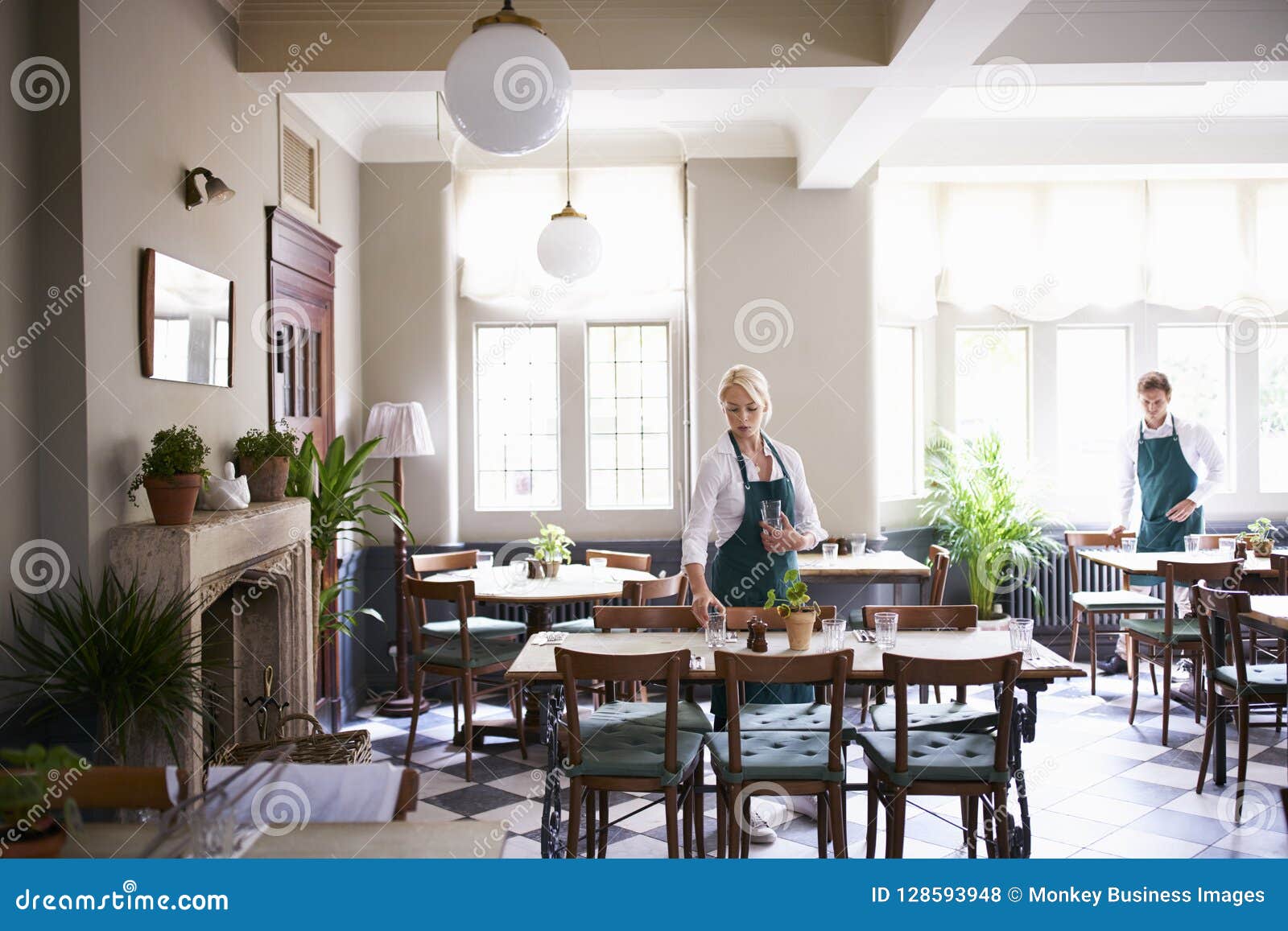 Staff Laying Tables in Empty Restaurant Stock Photo - Image of ...