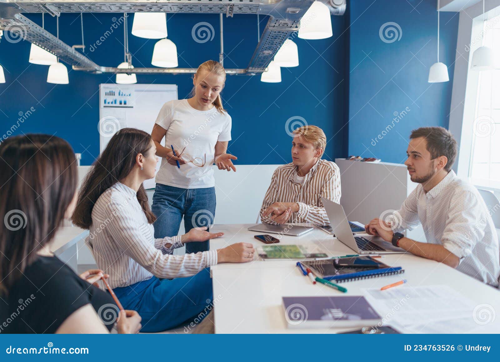 Staff in the Office Gathered Together at One Table Stock Photo - Image ...