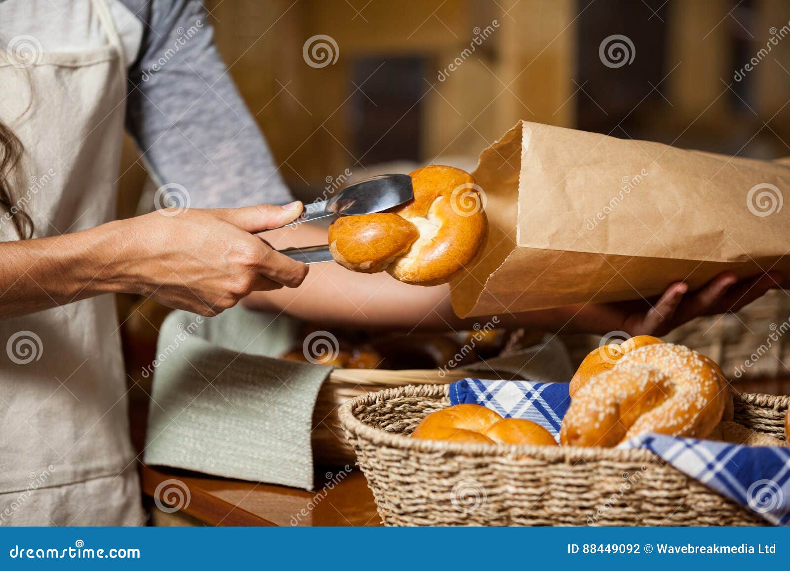 Staff Packing Bread in Paper Bag at Bakery Shop Stock Photo - Image of ...