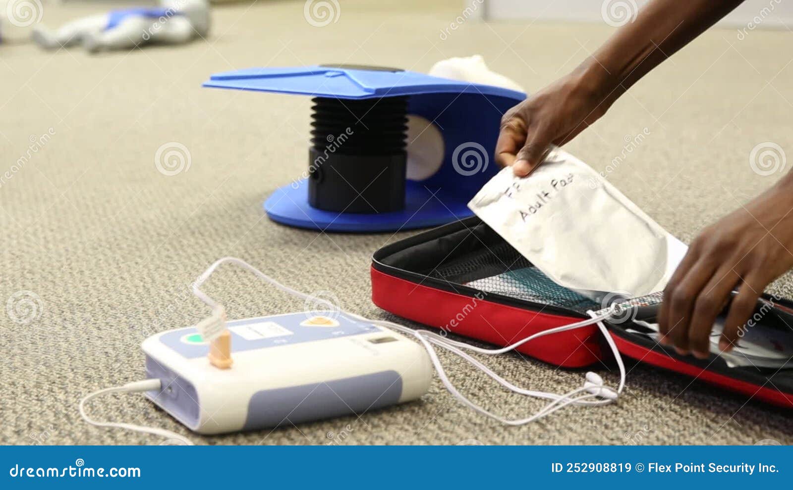 Staff Practicing First Aid Cpr with AED Machine and Dummy Dolls Stock ...