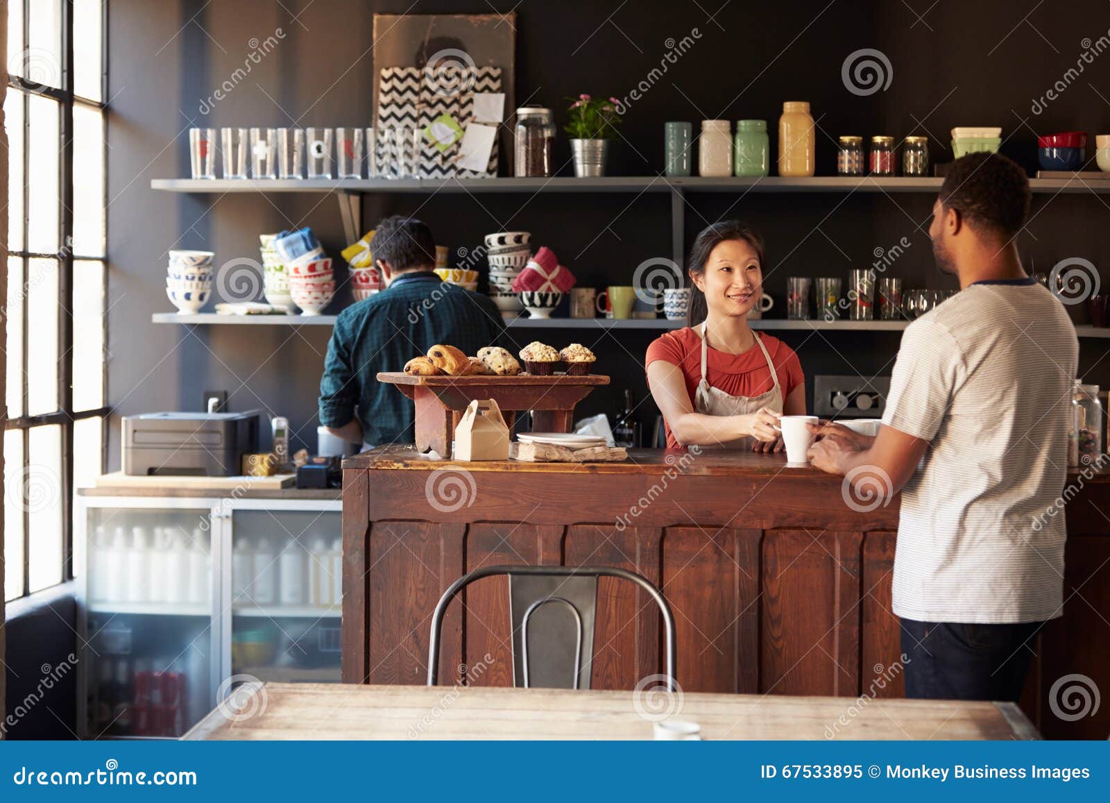 Staff Serving Customer in Busy Coffee Shop Stock Image - Image of asian ...