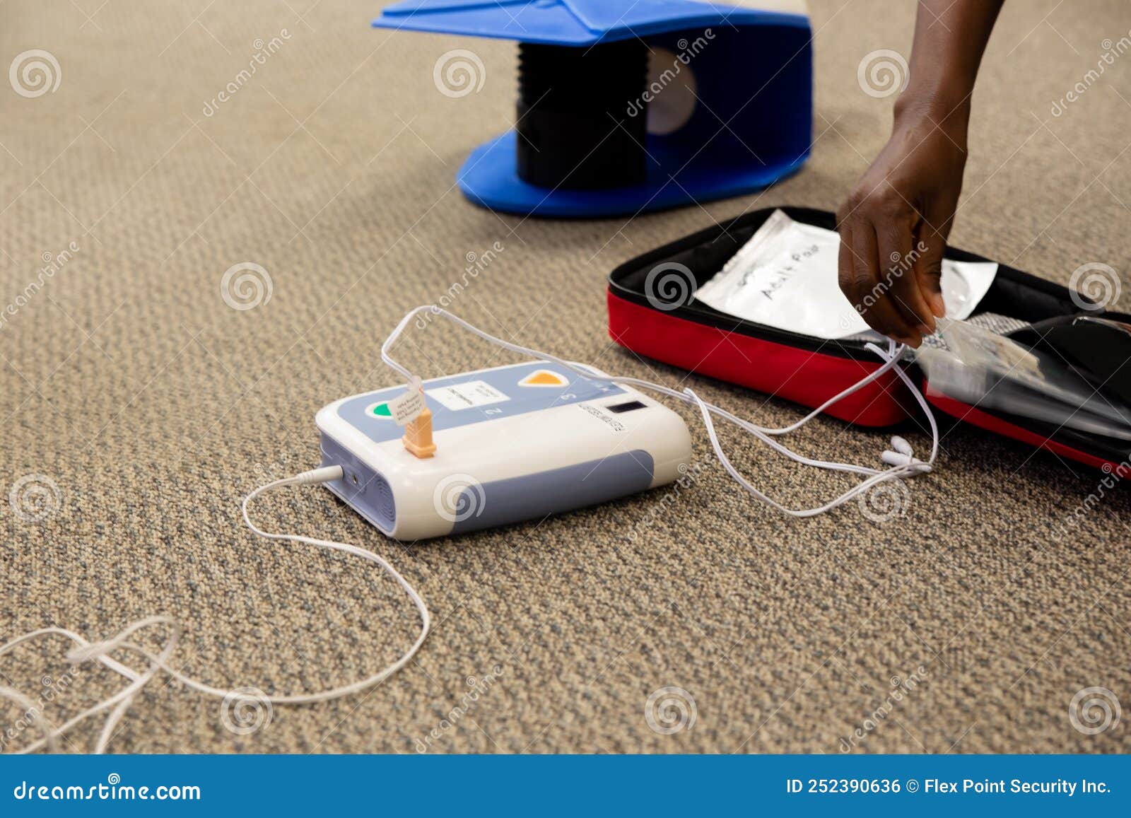 Staff Setting AED Machine To Practice First Aid Stock Photo - Image of ...