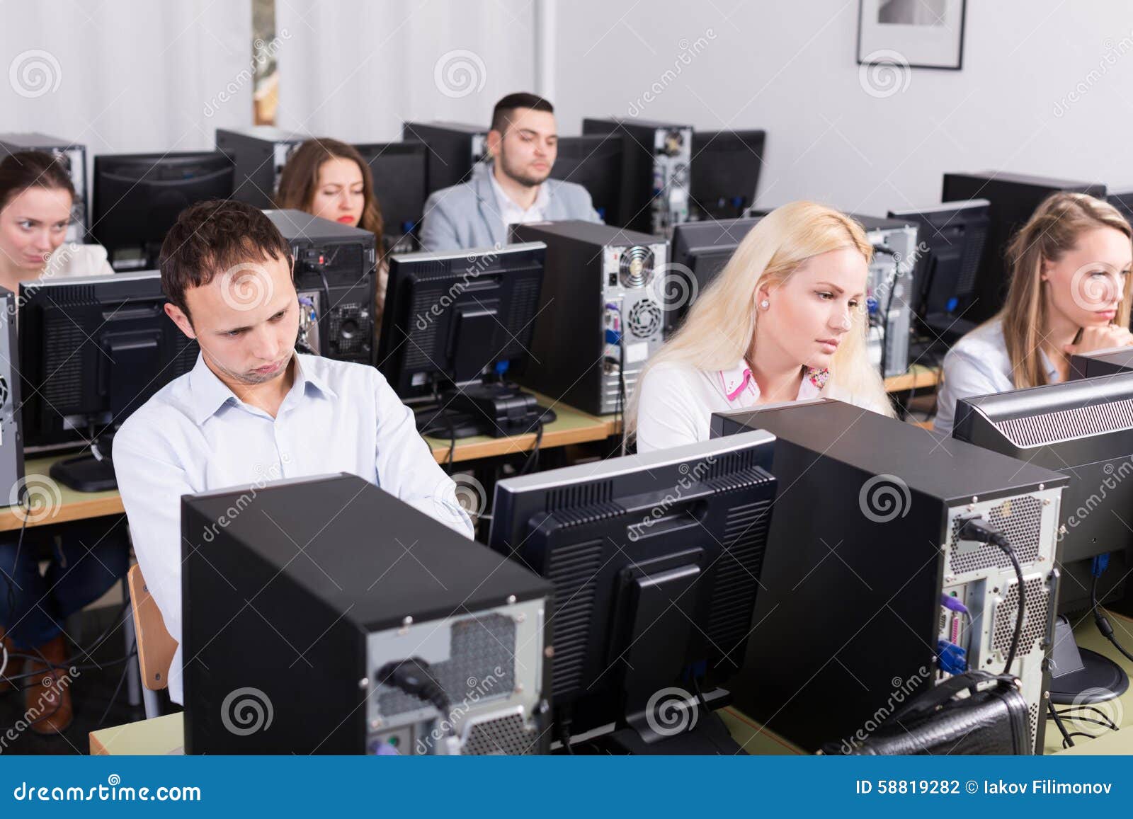 Staff Sitting at Desks and Looking at PC Screens Stock Photo - Image of ...