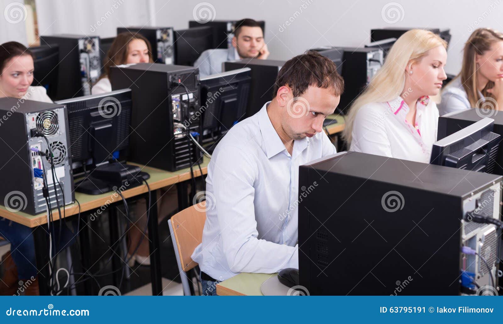 Staff Sitting at Desks and Looking at PC Screens Stock Image - Image of ...