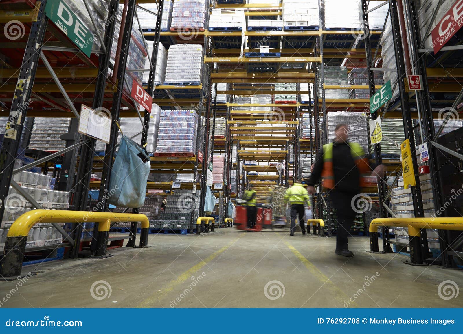 Staff in a Warehouse Move between Storage Racks, Motion Blur Stock ...