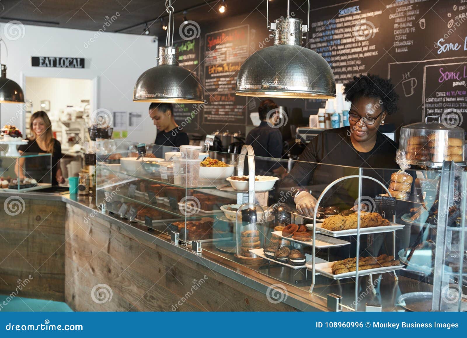 Staff Working Behind Counter in Busy Coffee Shop Stock Photo - Image of ...
