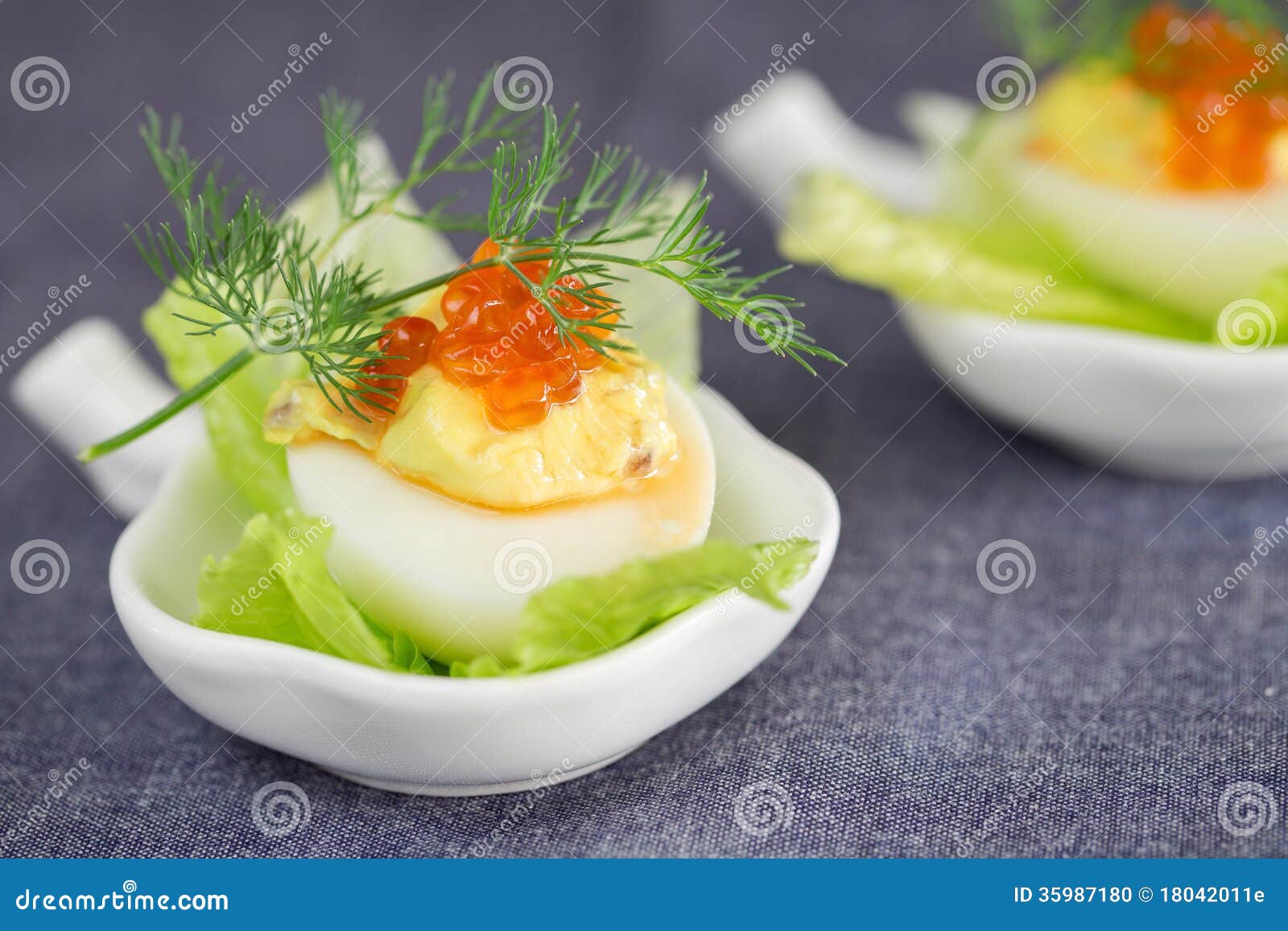 Staffed Egg Appetizer with Red Caviar Garnish and Dill Decoration Stock ...