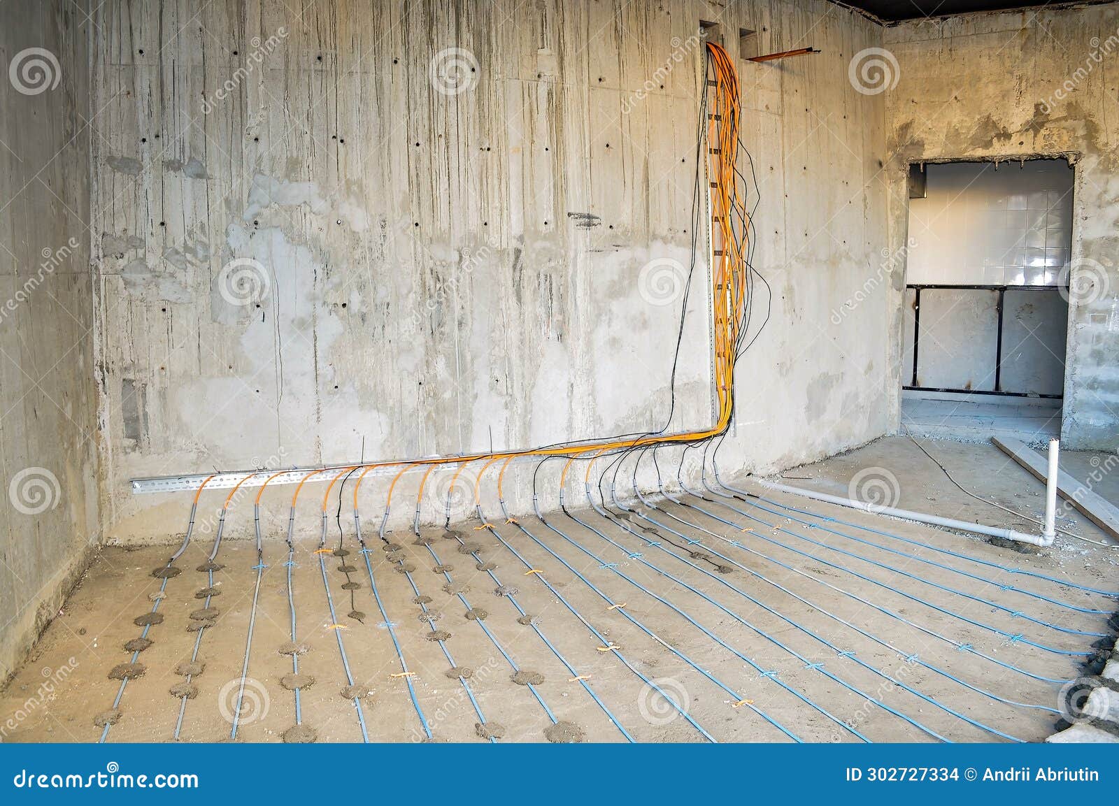 The Stage of Installation of a Cable for a Warm Floor on Concrete, a ...