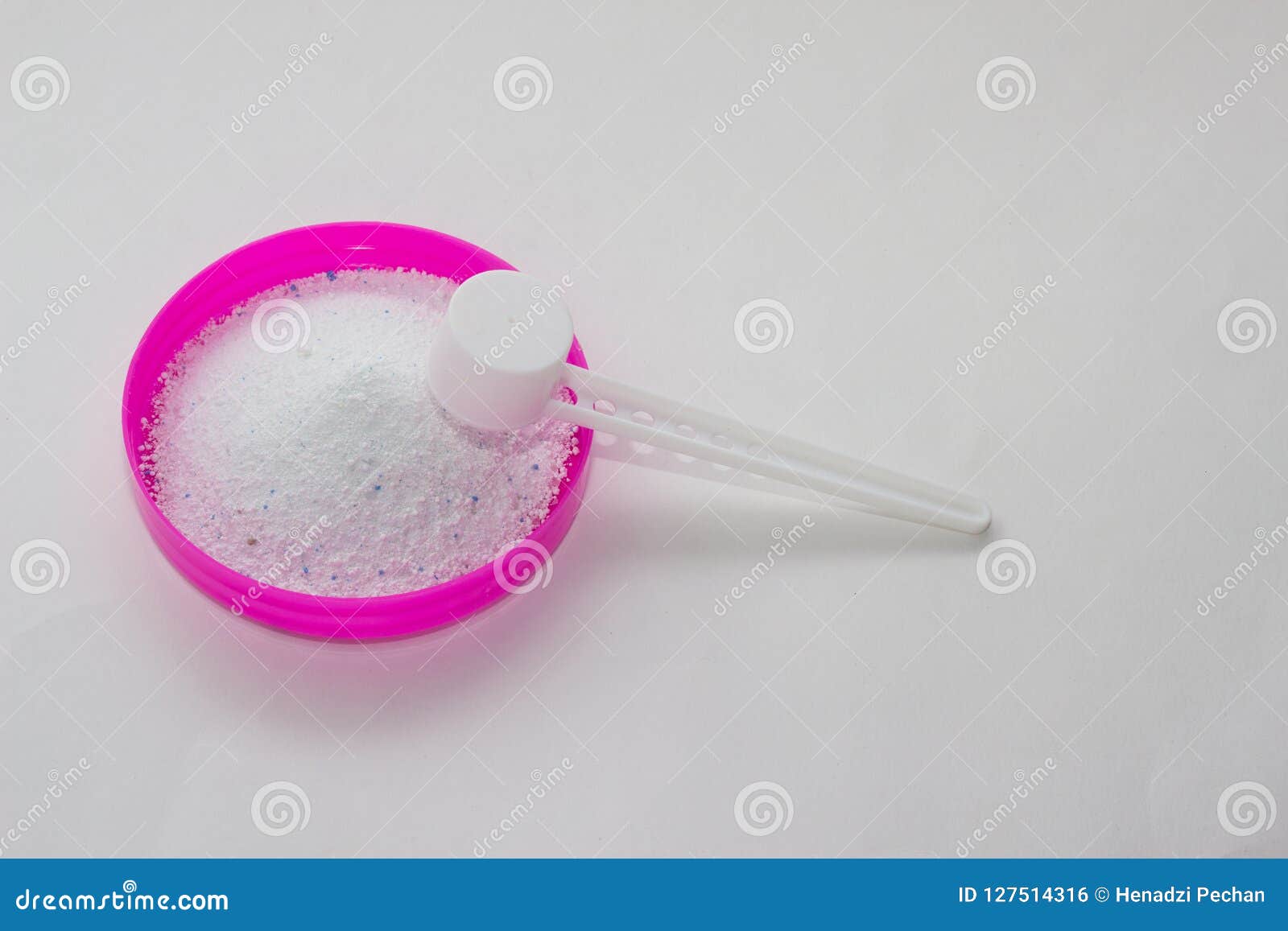 Stain Remover and Bleach on a Red Cover with a Measuring Spoon on a ...