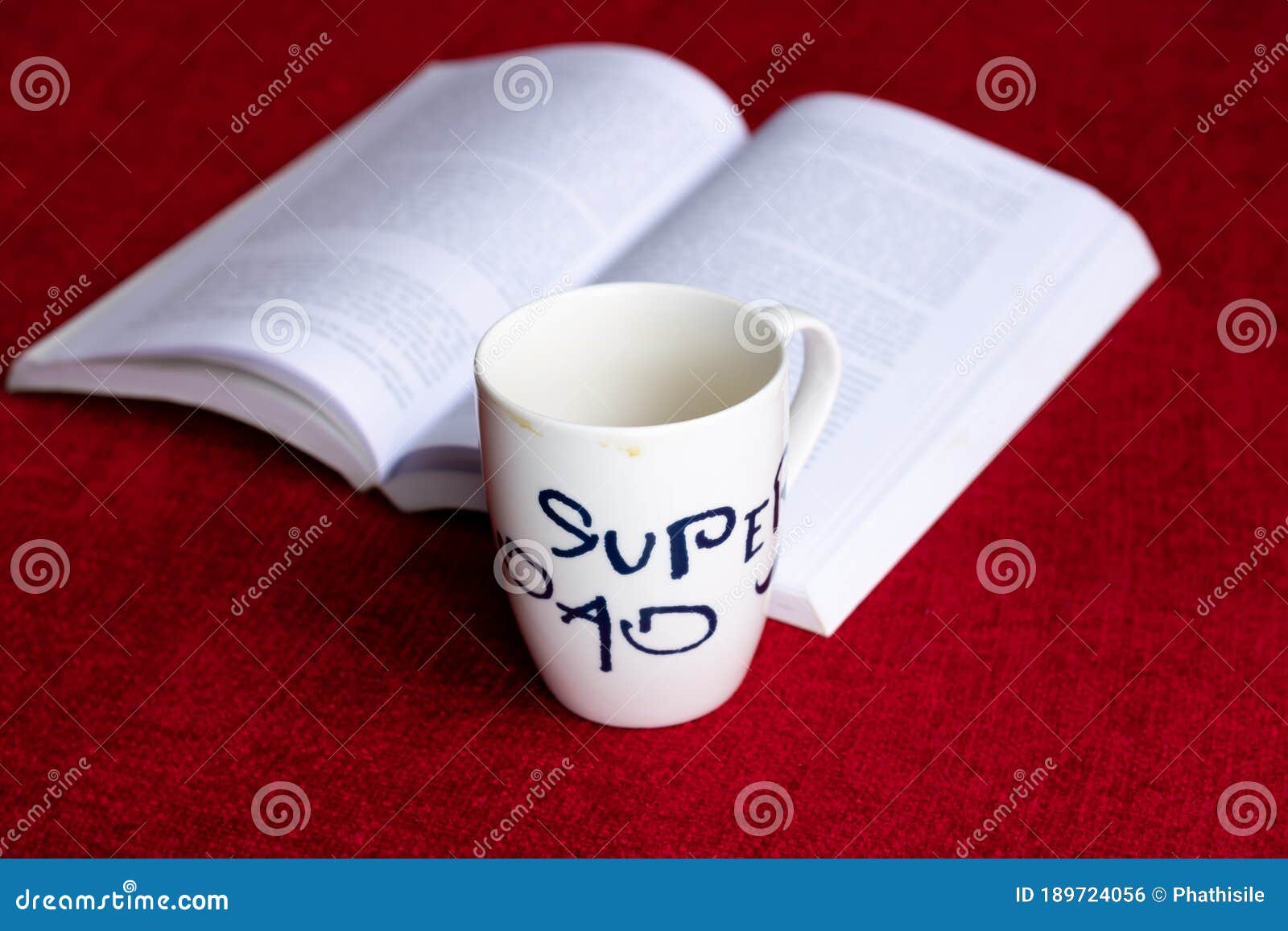 Stained Coffee Mug with an Open Book Stock Photo - Image of open ...