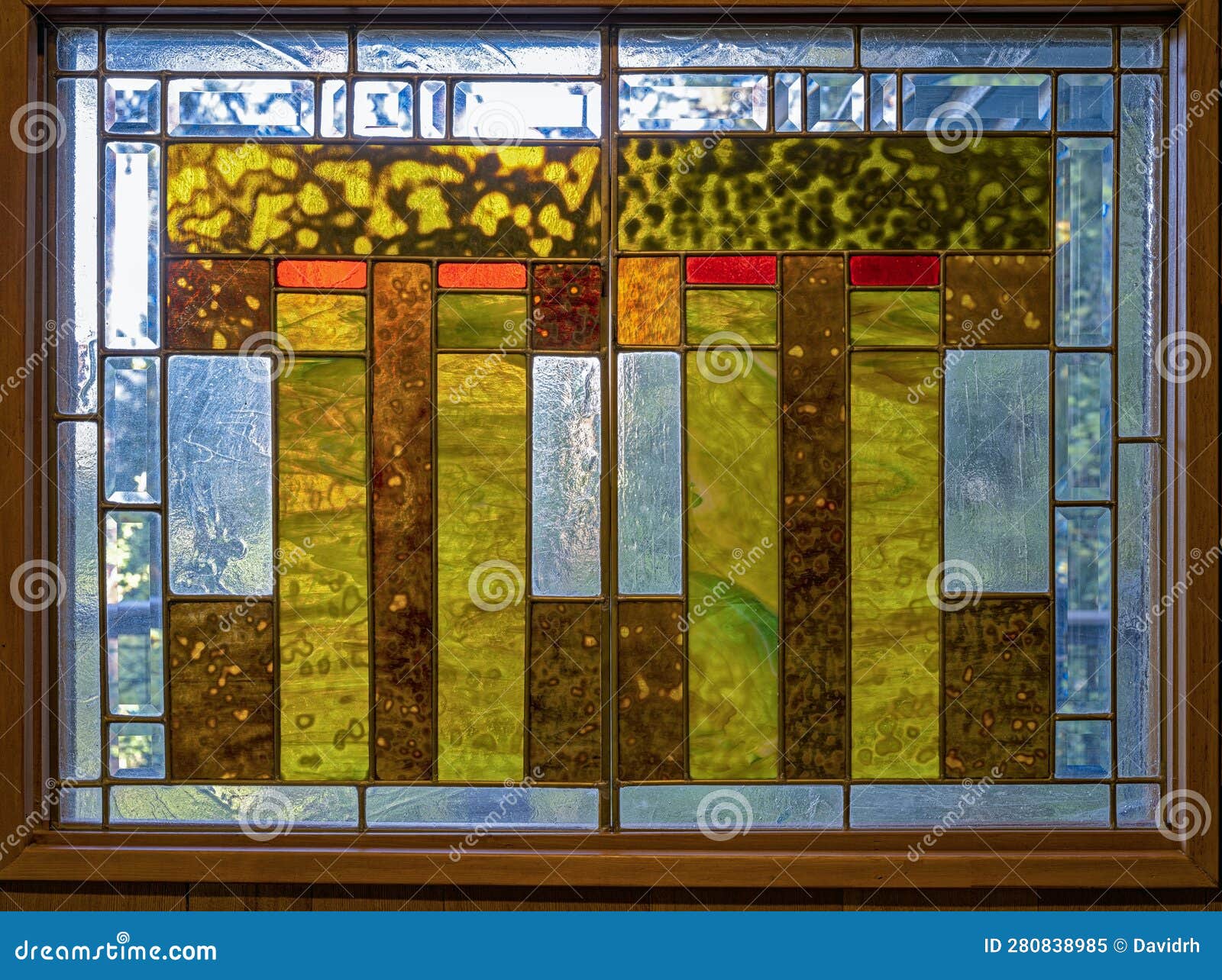 A Stained Glass Window with Two Sliding Panels in a Wood Frame Stock ...