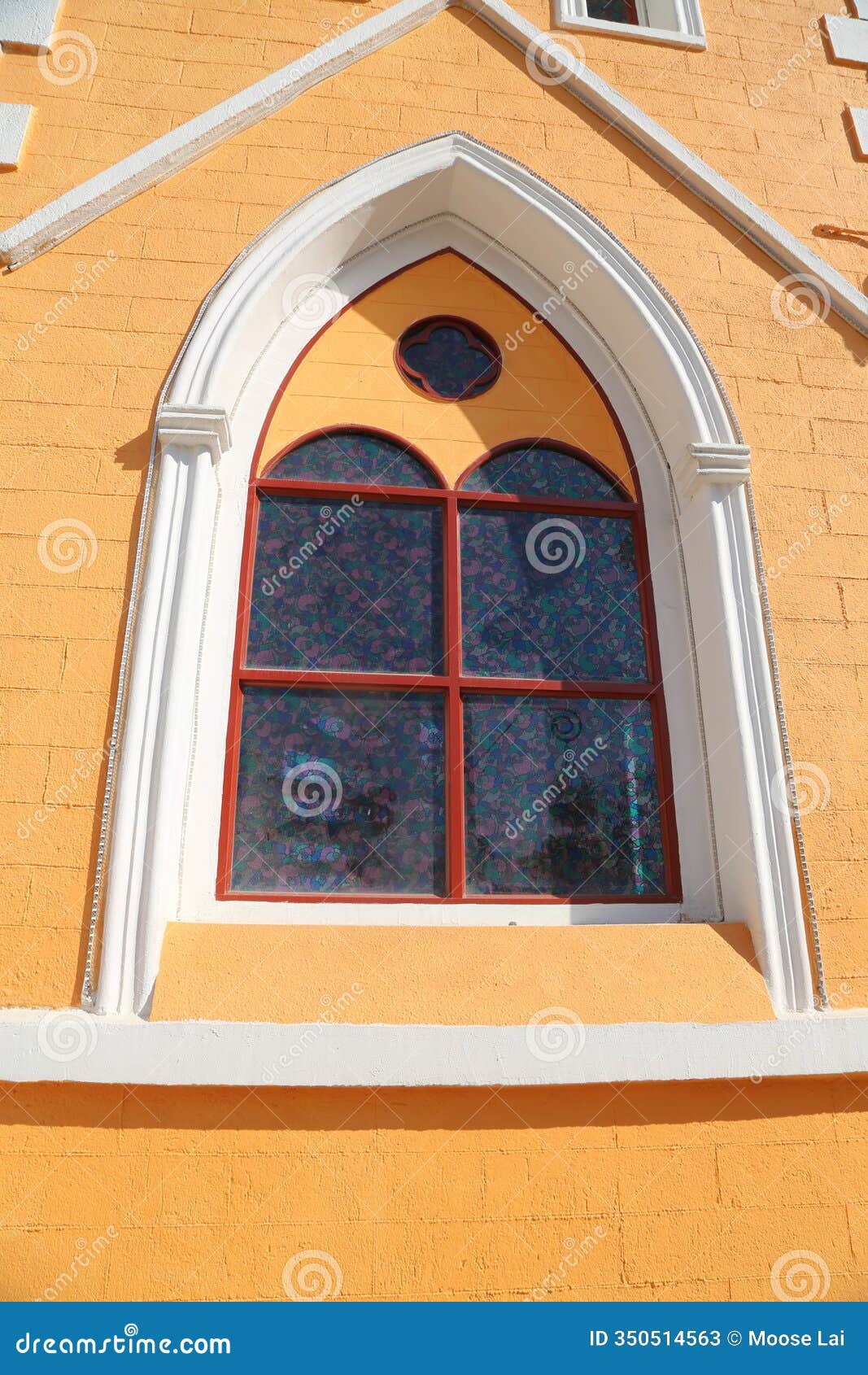 A Photograph of the Window Frames on an Orange Church with White Trim ...
