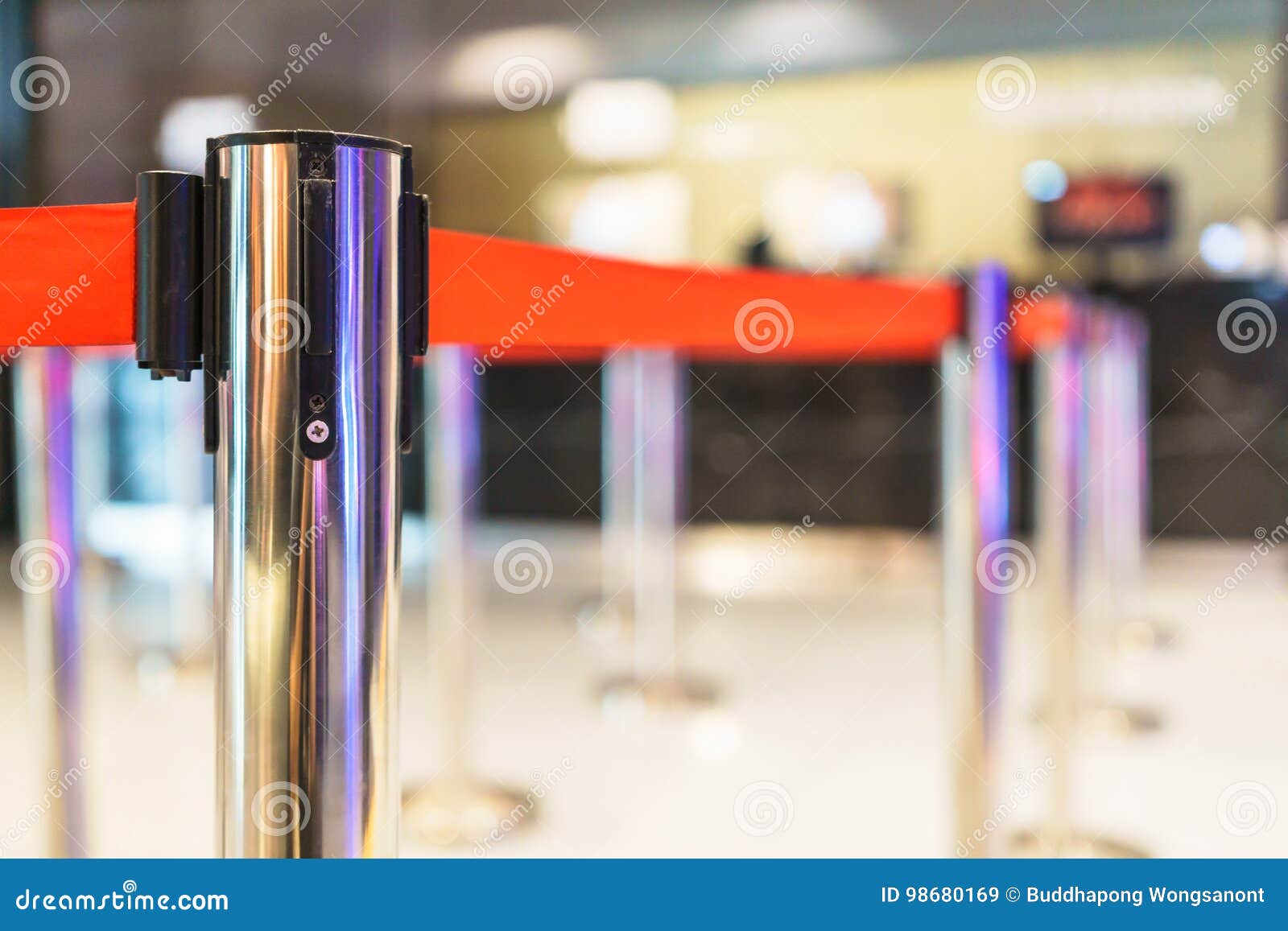 Stainless Barricade with Red Rope on Blurred Interior Background Stock ...