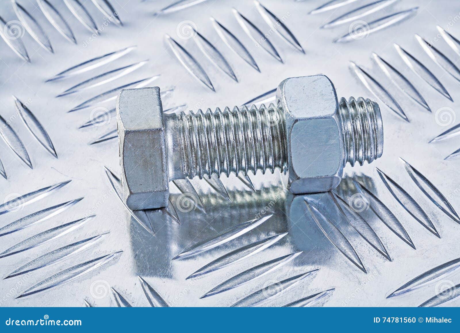 Stainless Bolt and Threaded Nut on Grooved Metal Plate Construct Stock ...