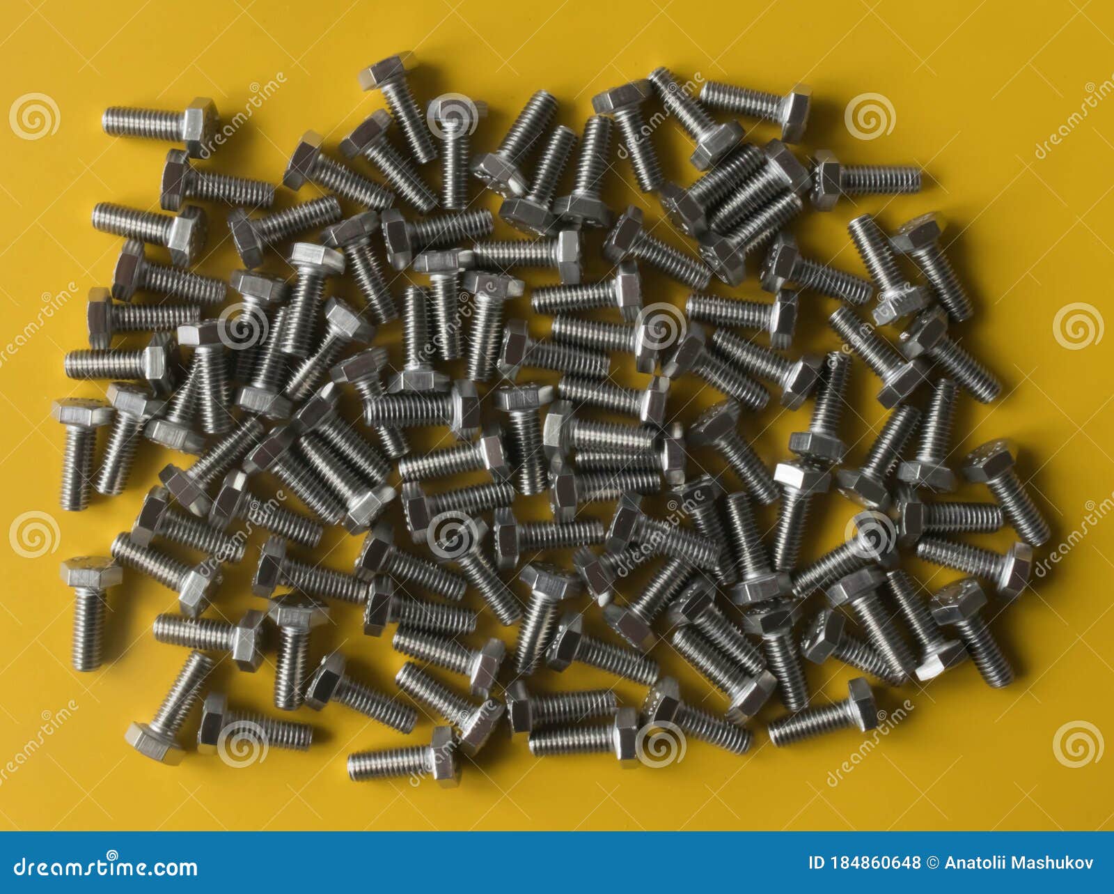 Stainless Bolt on a Yellow Background Stock Photo - Image of ...