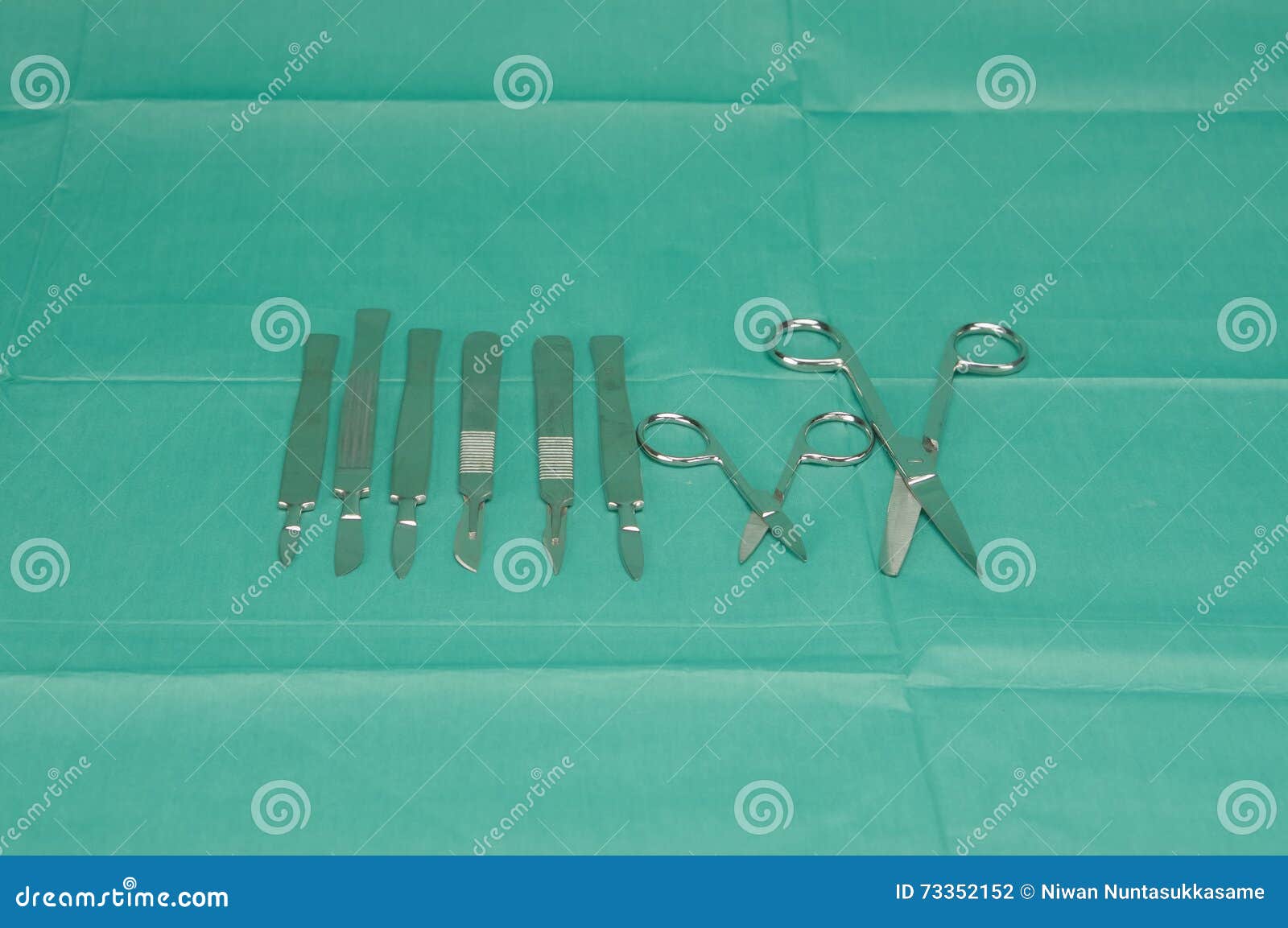 Stainless Scalpel and Scissors on Green Fabric Stock Photo - Image of ...