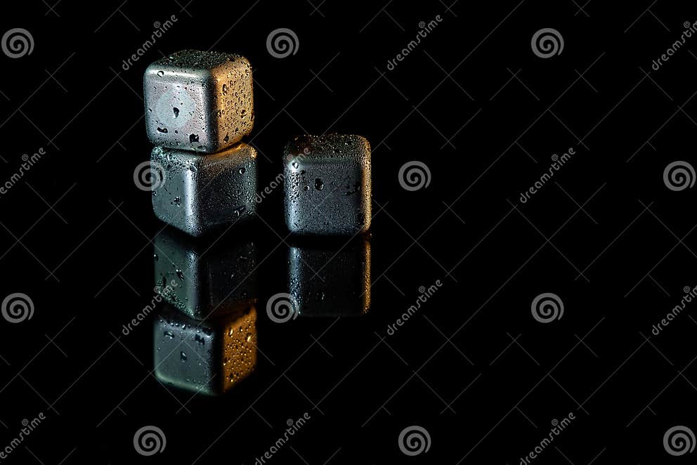 Stainless Steel Cubes Simulating Ice for Cooling Drinks on a Black ...