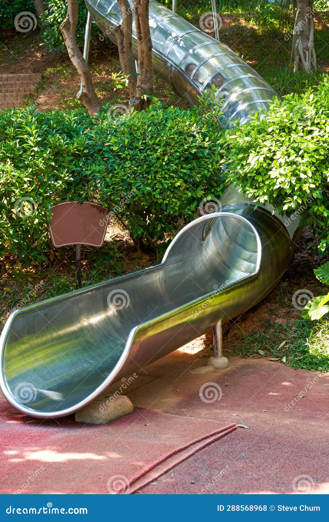Stainless Steel Cylinder Slide in the Park Playground Stock Photo ...