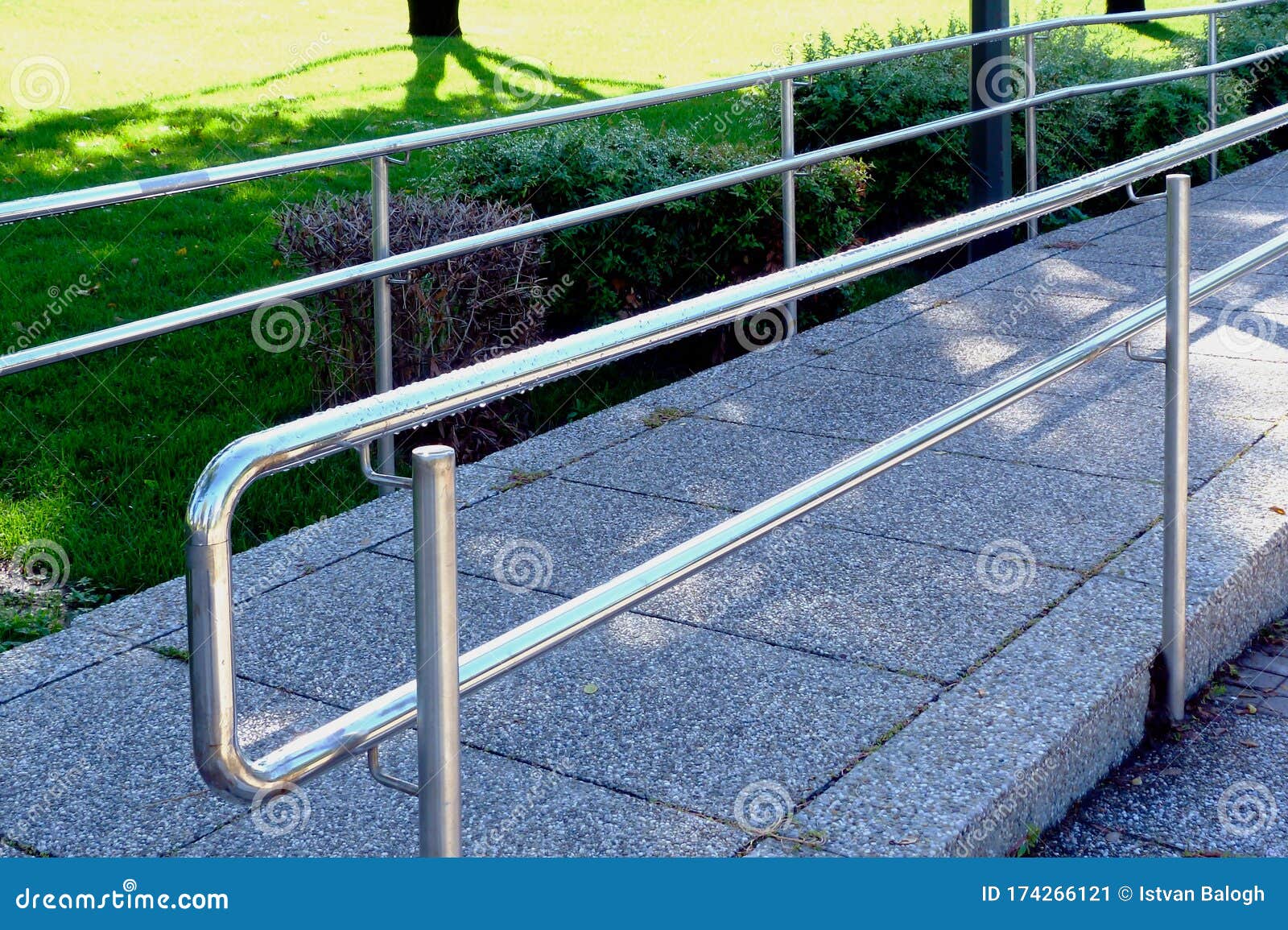 Stainless Steel Double Rail Along Concrete Tile Paved Handicapped Ramp ... Stainless Steel Double Rail Along Concrete Tile Paved Handicapped Ramp ...