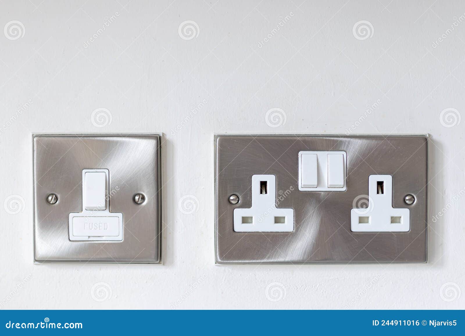 Stainless Steel Electric Double Socket and a Fused Switch Mounted on a ...